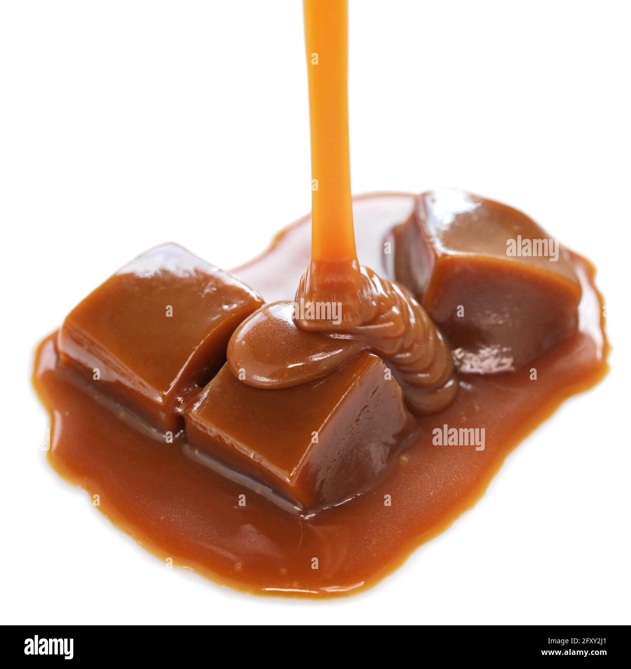 pouring homemade caramel sauce on caramel candies Stock Photo - Alamy