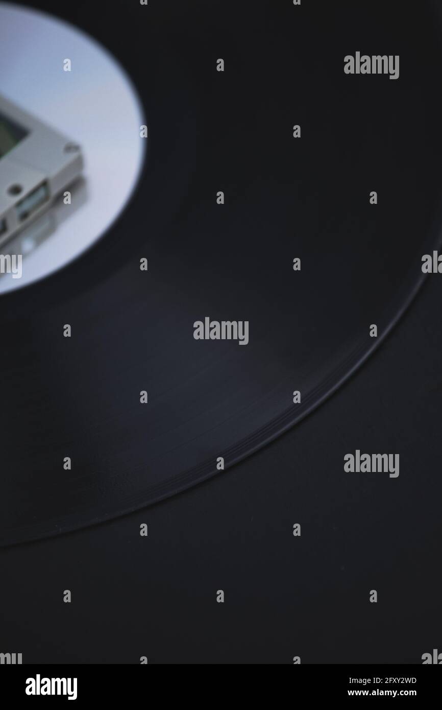 !2 inch LP vinyl record and audio cassette tape. Concept of retro ...