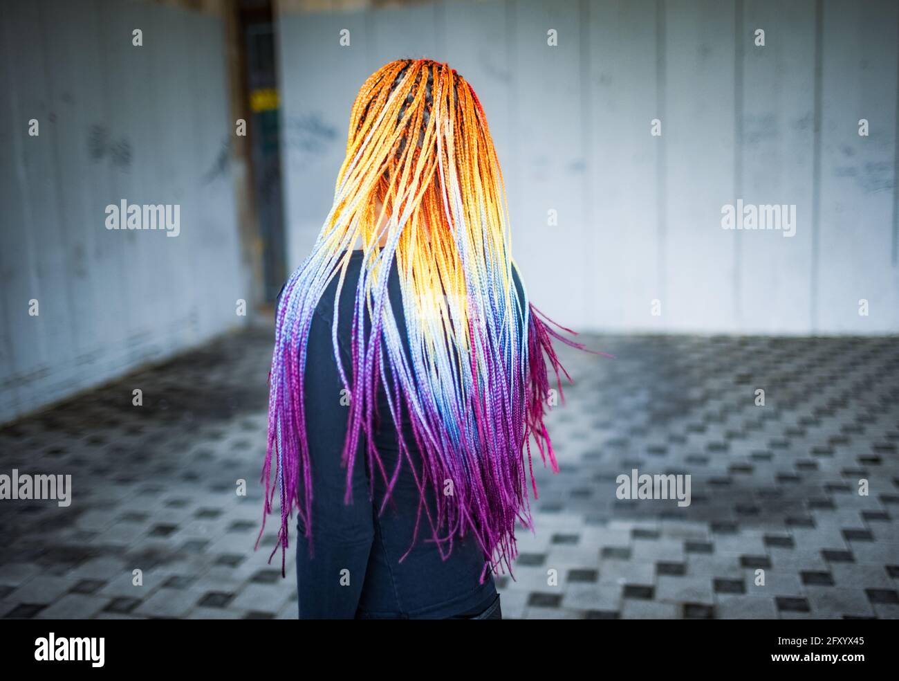 Fashionable unknown girl in an elegant beige jacket with multi-colored ...