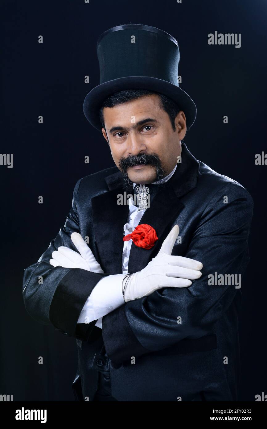 Male magician in black suit hi-res stock photography and images - Alamy