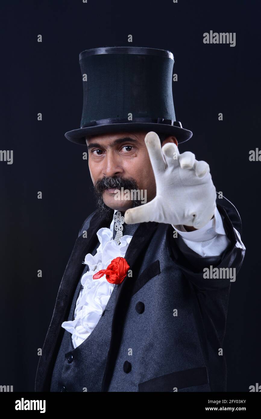 Male magician in black suit hi-res stock photography and images - Alamy