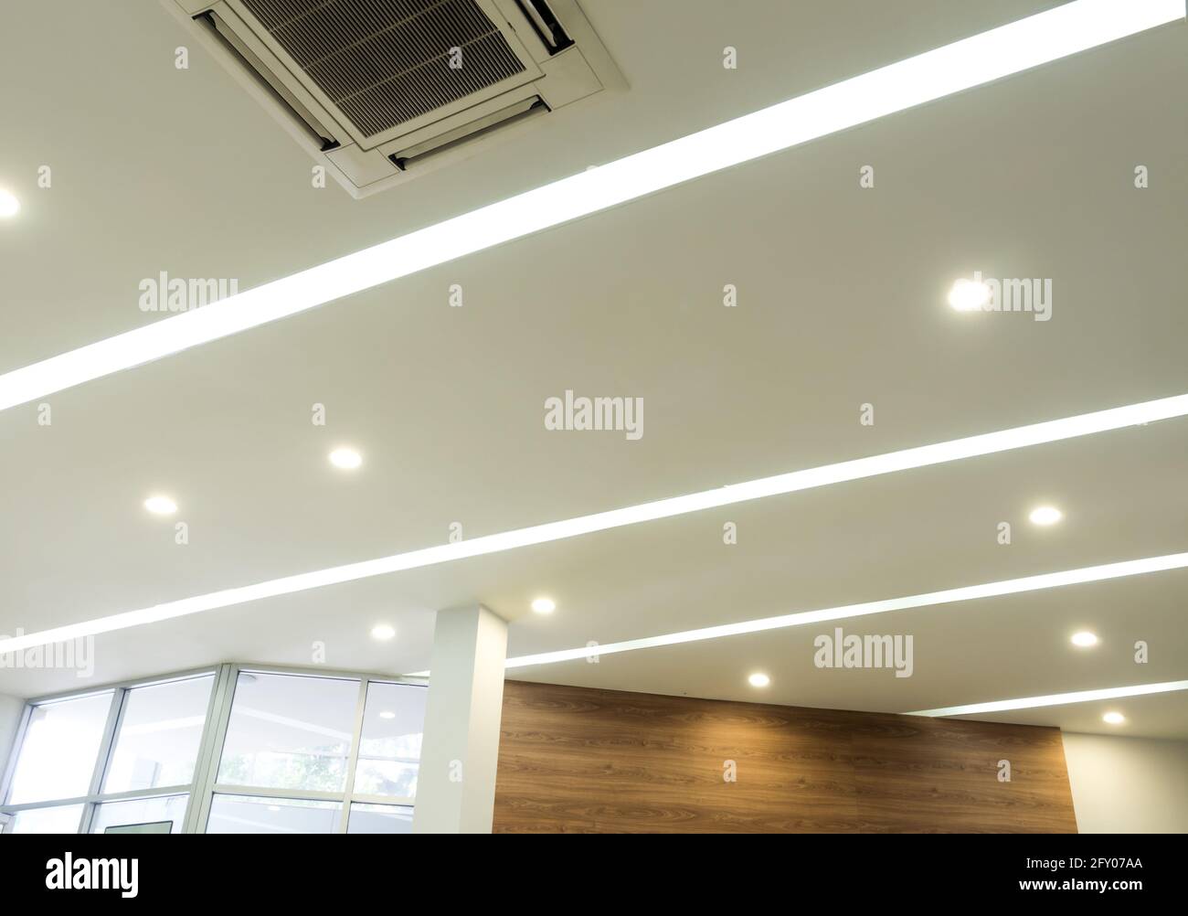 Lighting and ceiling mounted air conditioner on the modern office ...