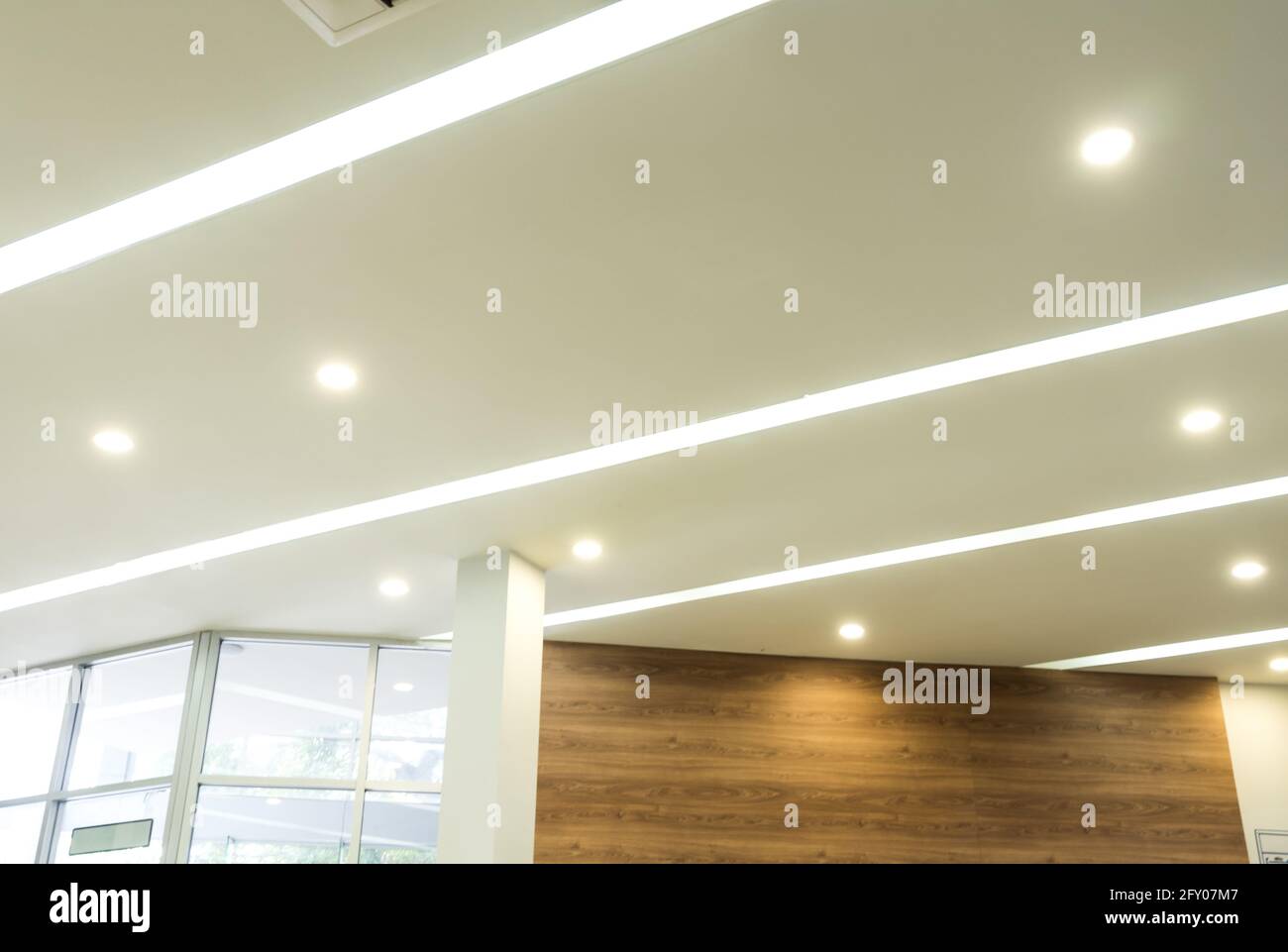 Lighting and ceiling mounted air conditioner on the modern office ...