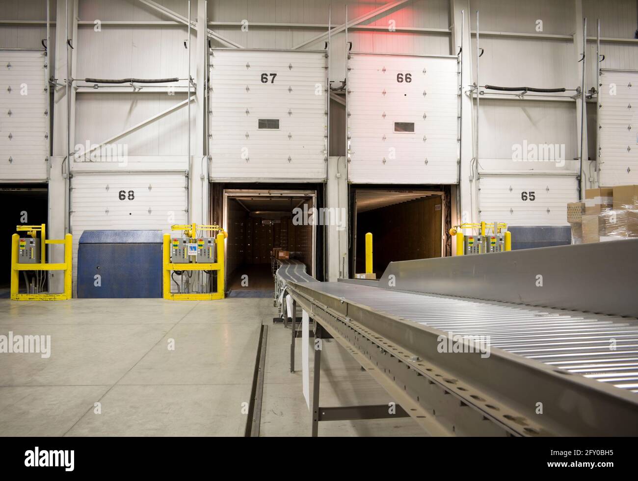 Conveyor belt in cross dock loading packages to back of truck Stock ...