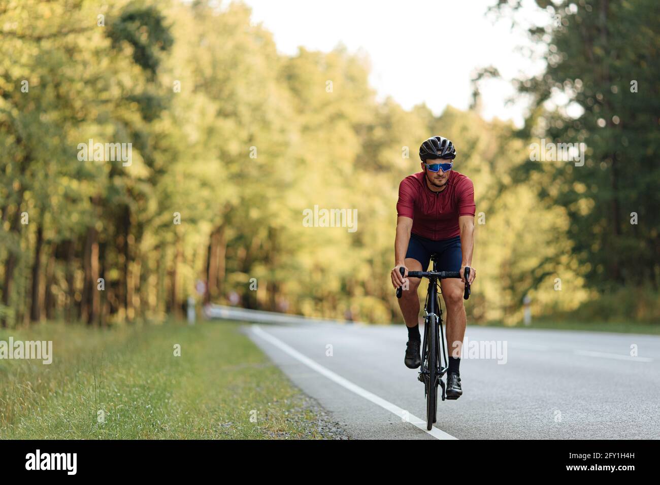 Professional road cyclist racing on bike outdoors Stock Photo - Alamy