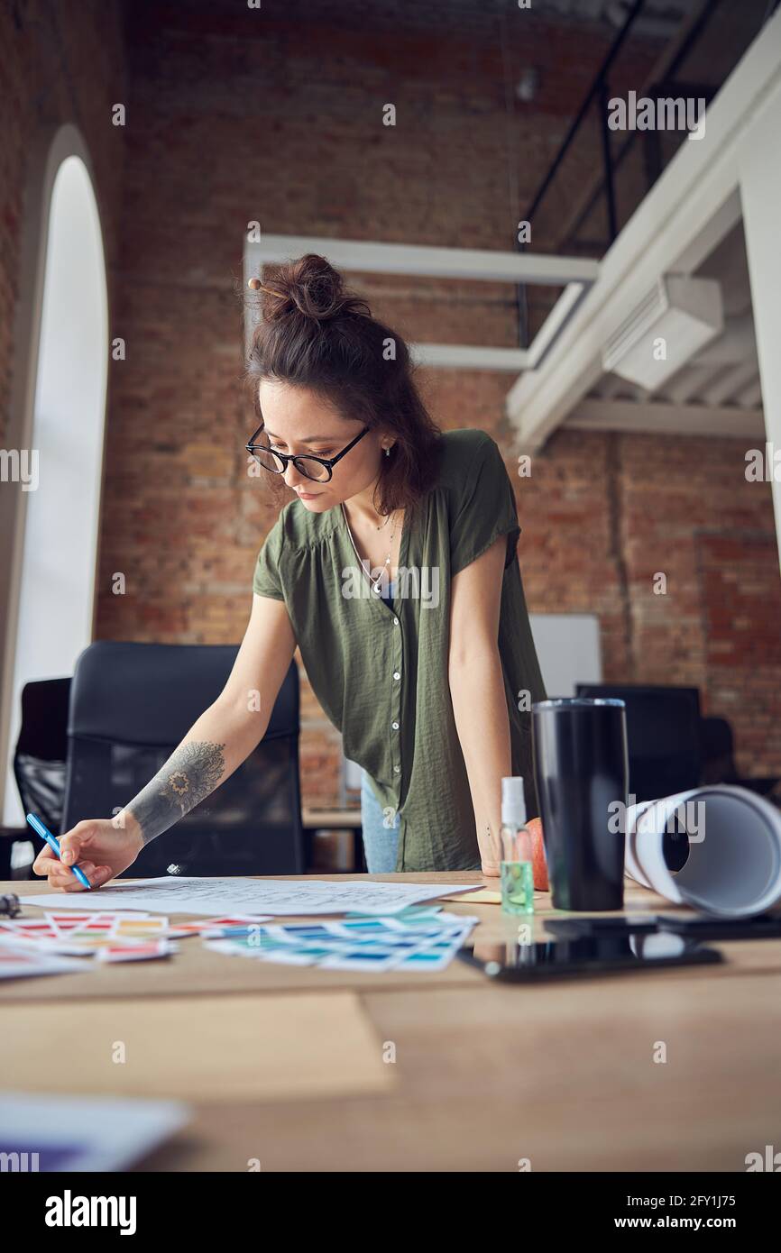 Designer holding blueprint writing on hi-res stock photography and ...