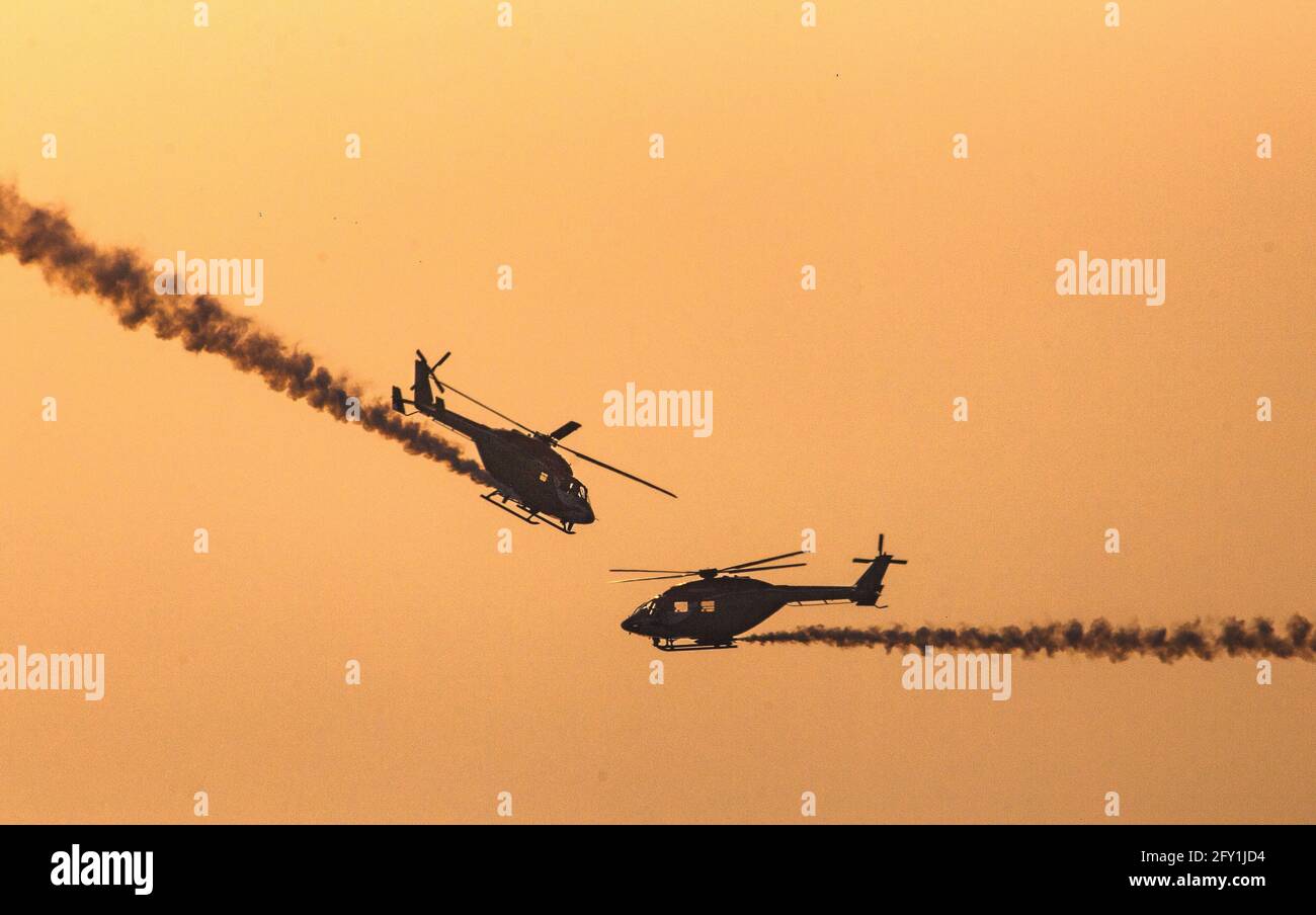 Military aviation helicopters in background of the vibrant orange toned ...
