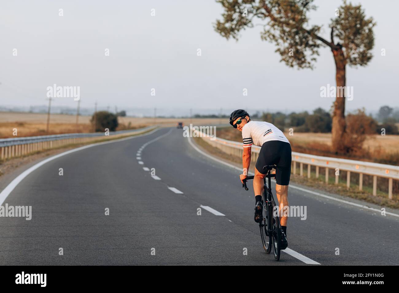 Young male on bicycle helmet hi-res stock photography and images - Alamy