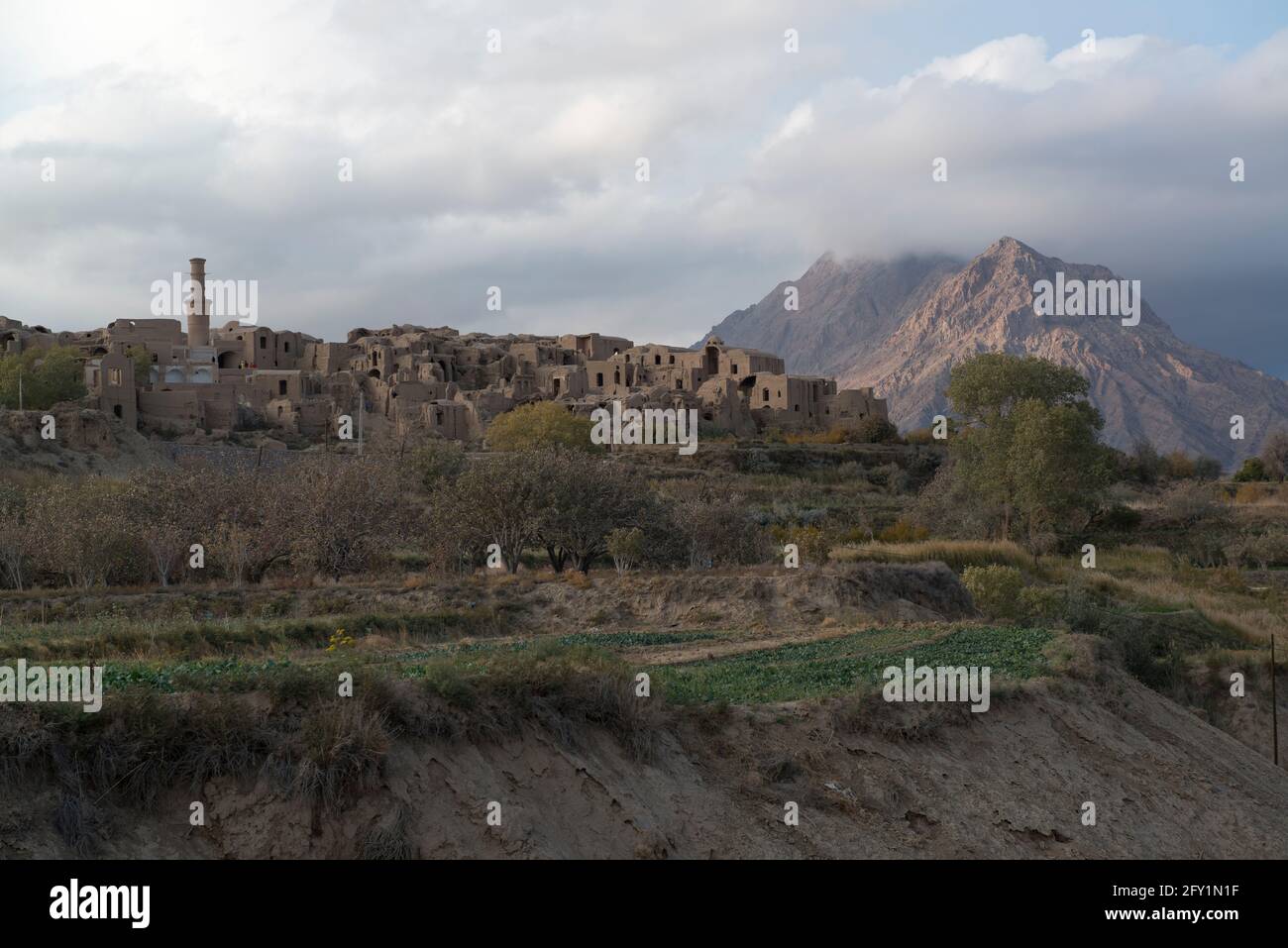 The 1000 years old collapsed mud-brick village of Kharanaq seen from a ...