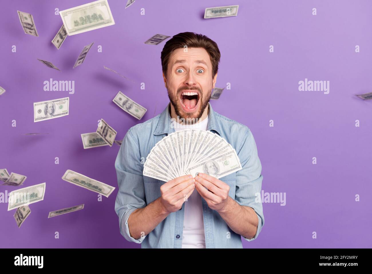 Photo of crazy amazed shocked young man scream happy lottery money ...