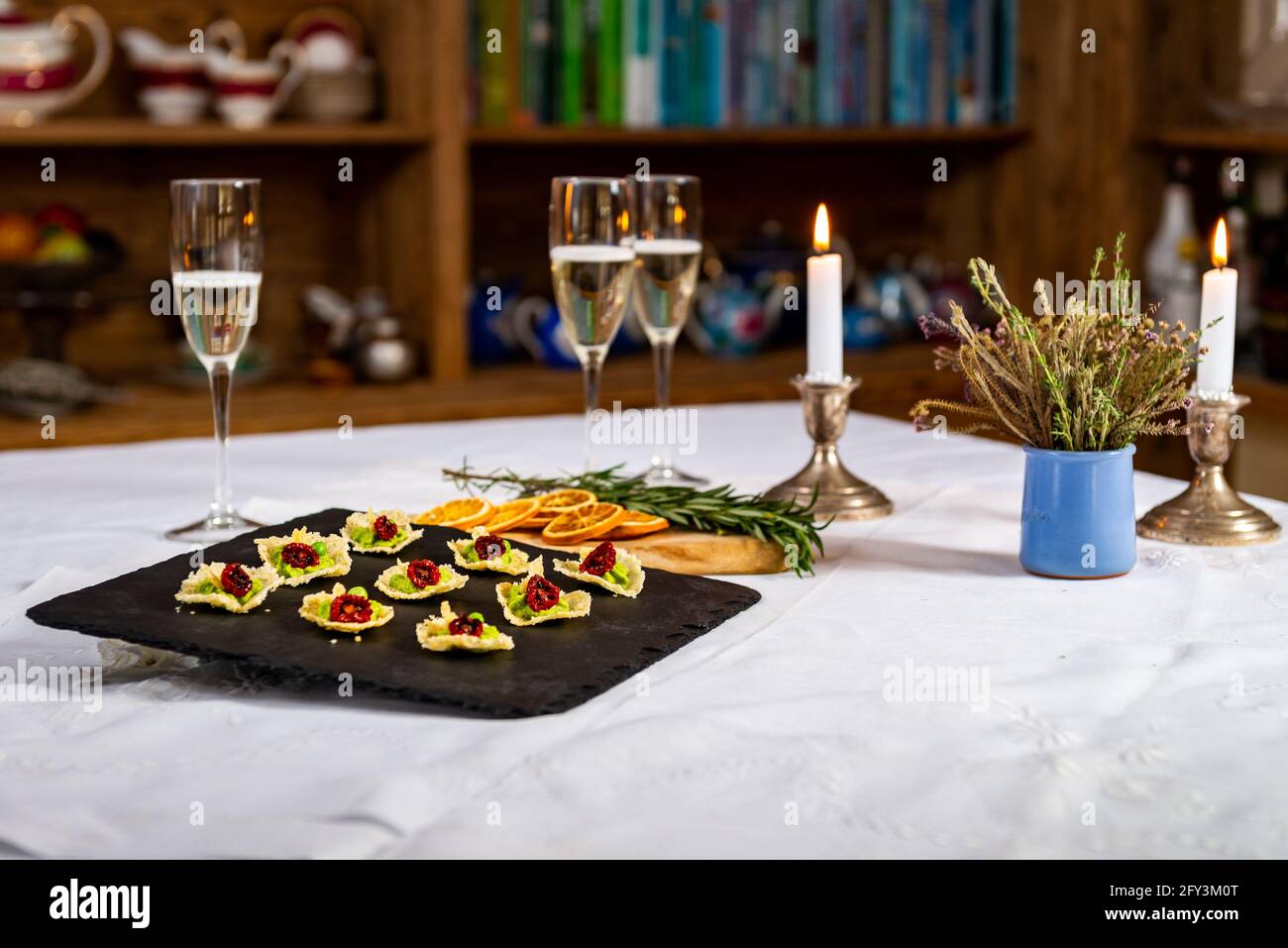 Glass champagne plate canapes hi-res stock photography and images - Alamy