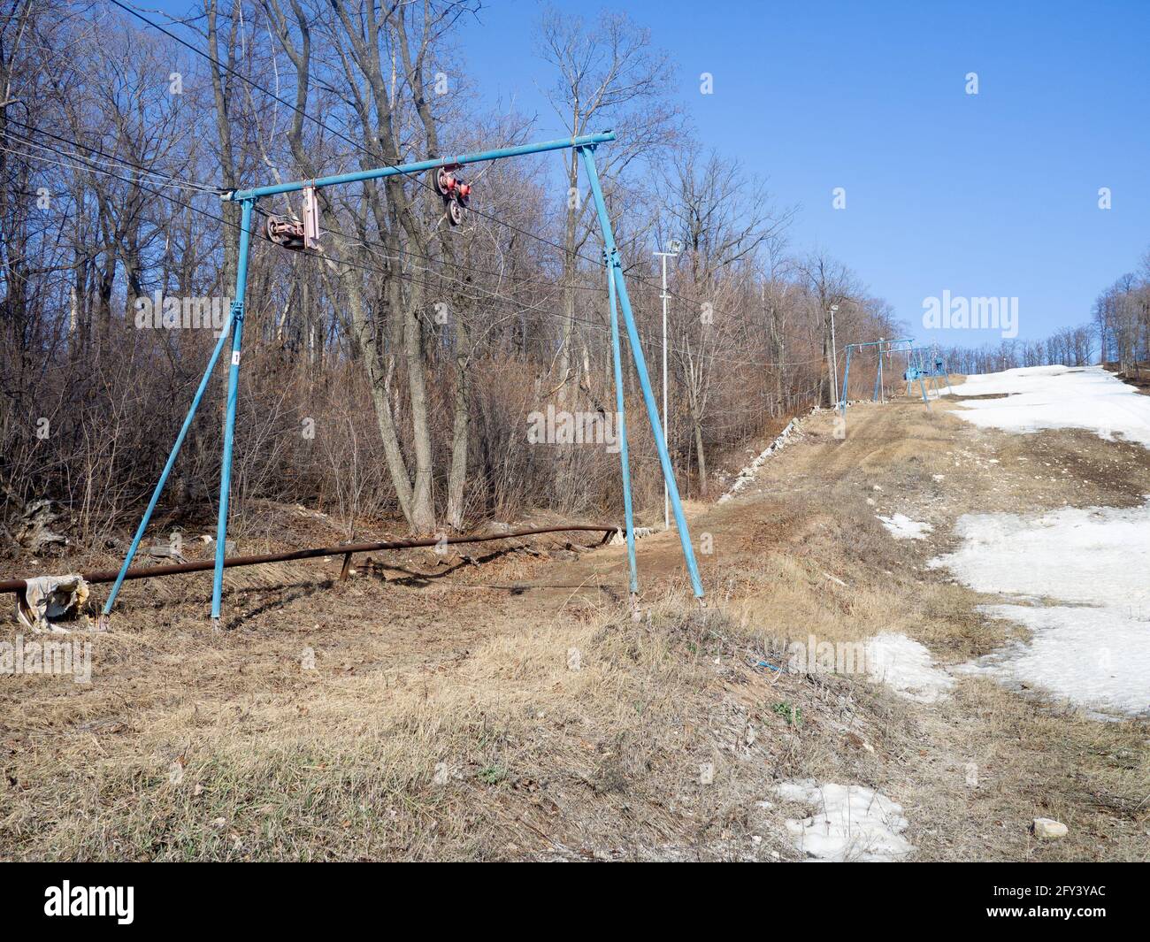 Ski slopes and ski lifts on on resort by spring, melted snow Stock ...