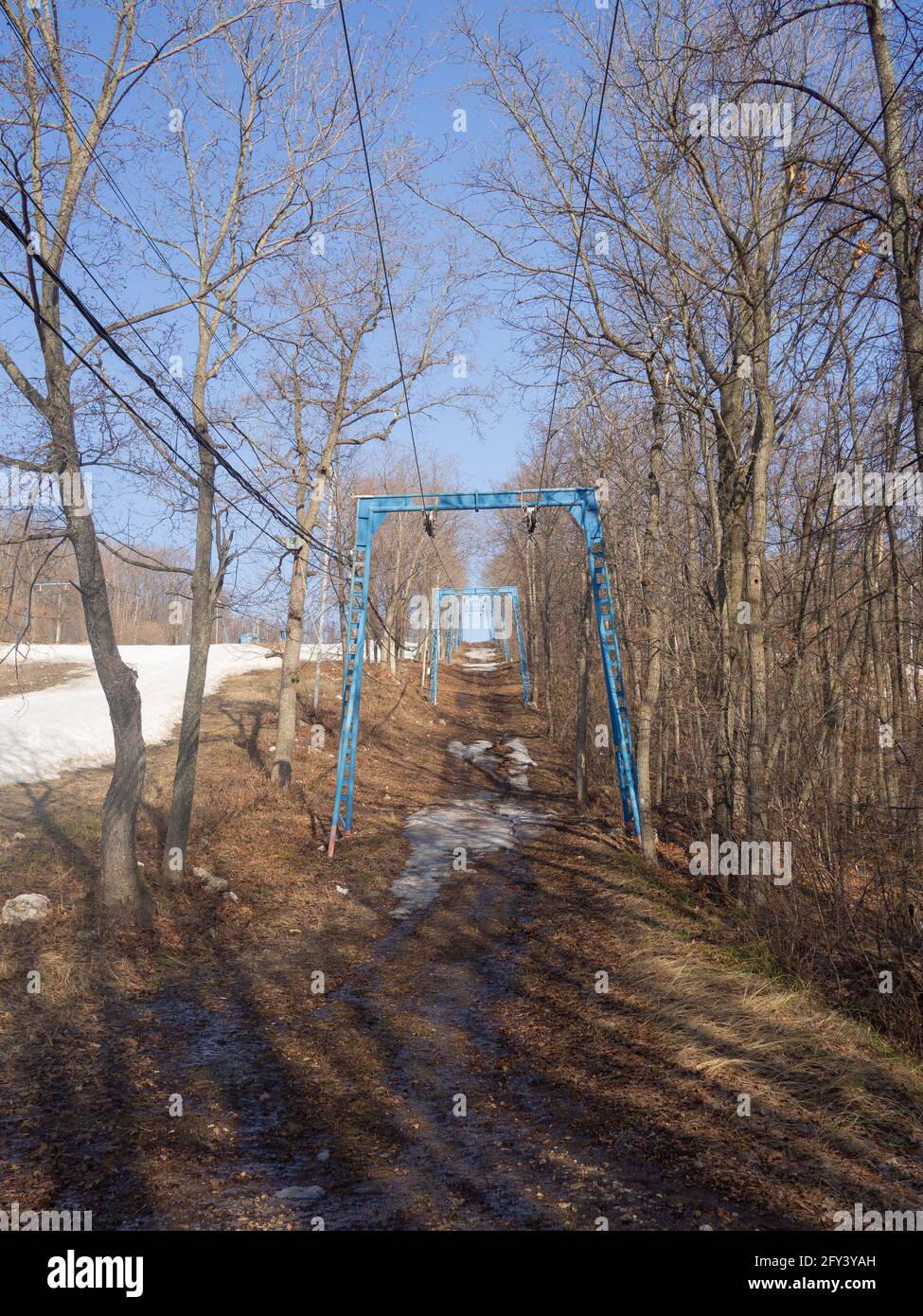 Ski slopes and ski lifts on on resort by spring, melted snow Stock ...