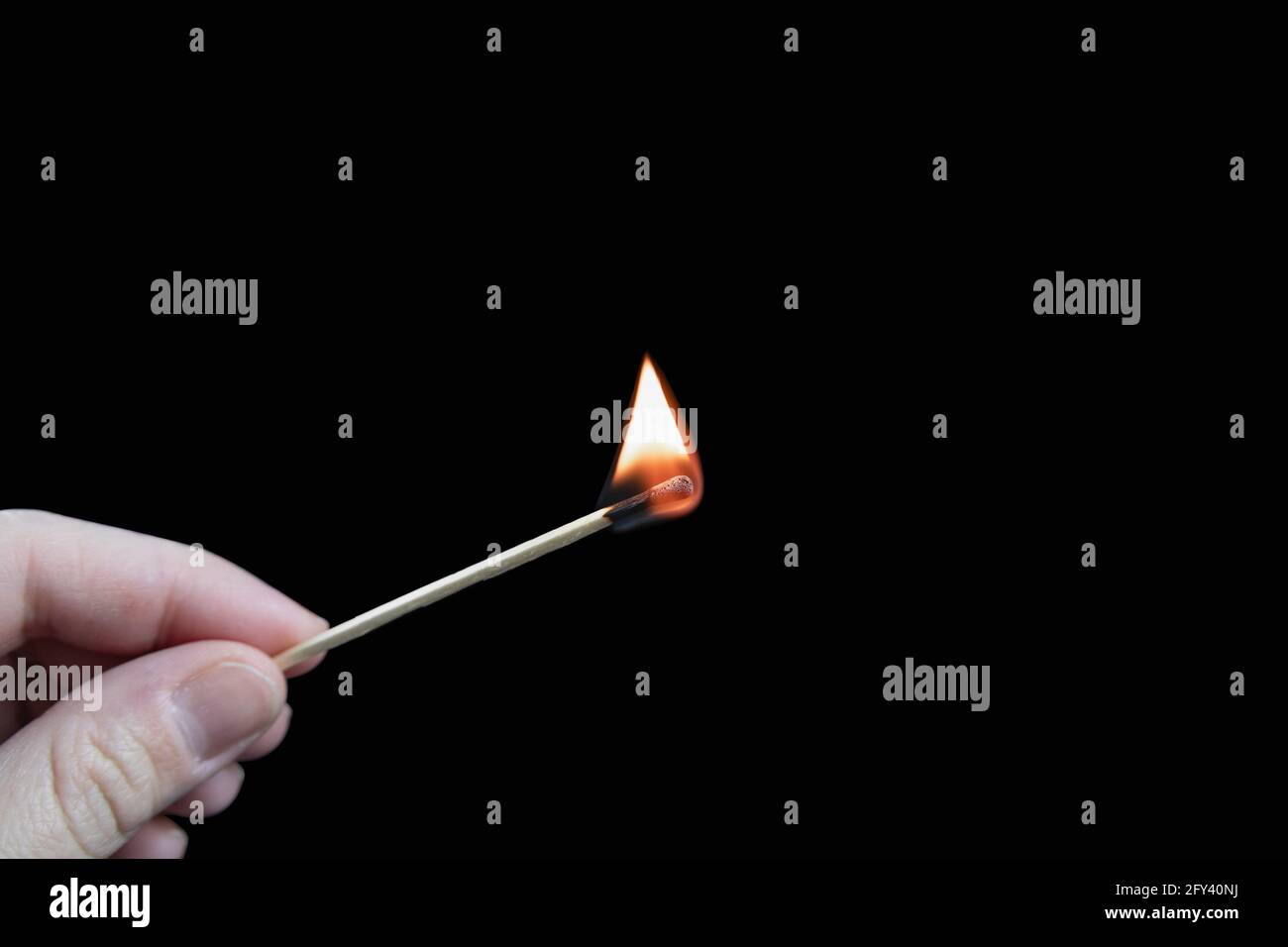Human fingers with burning match on black background Stock Photo - Alamy