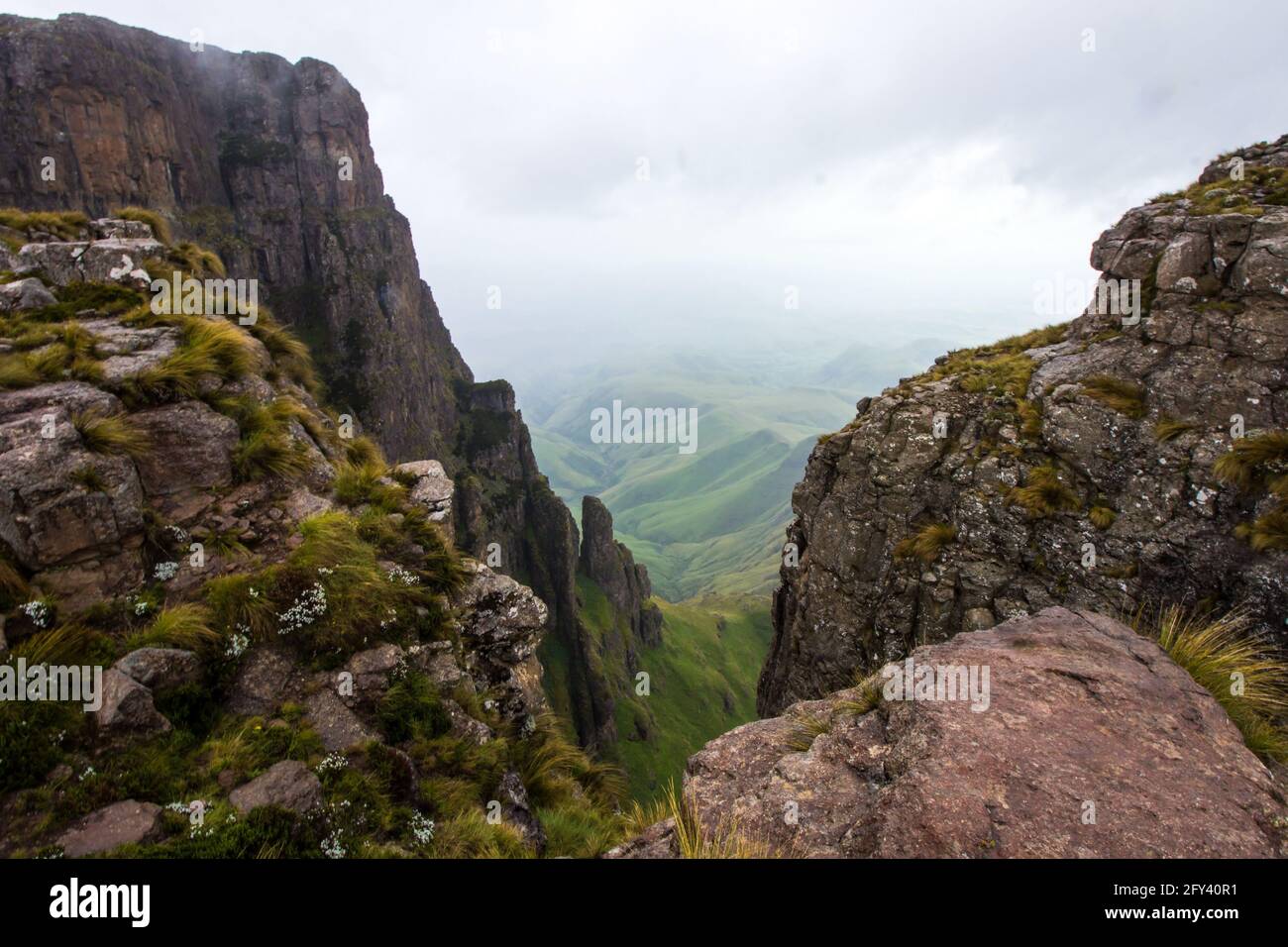 Looking over the edge at Castle Buttress, in the Drakensberg Mountains ...