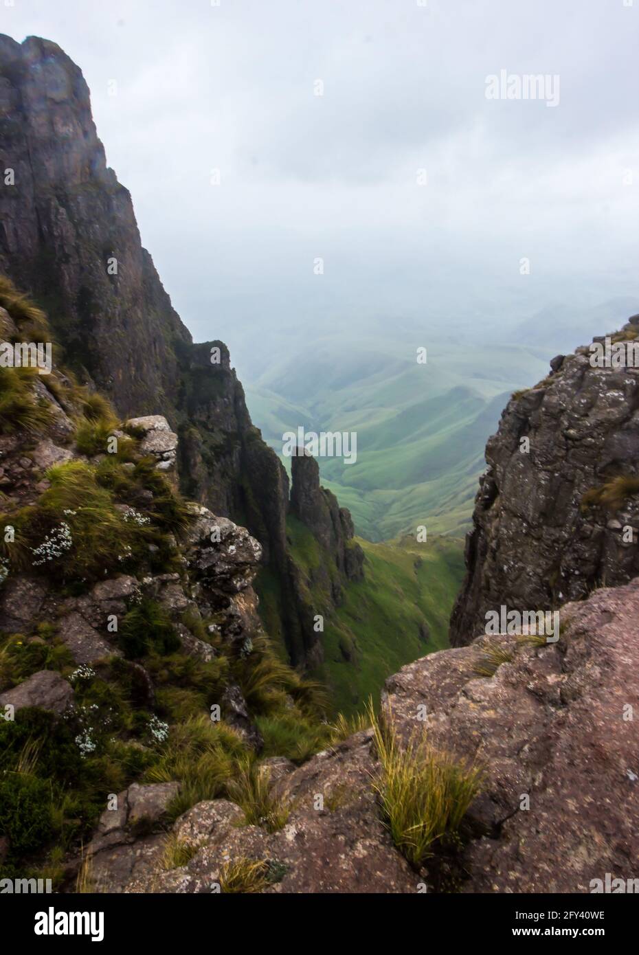 Looking over the edge at Castle Buttress, in the Drakensberg Mountains ...