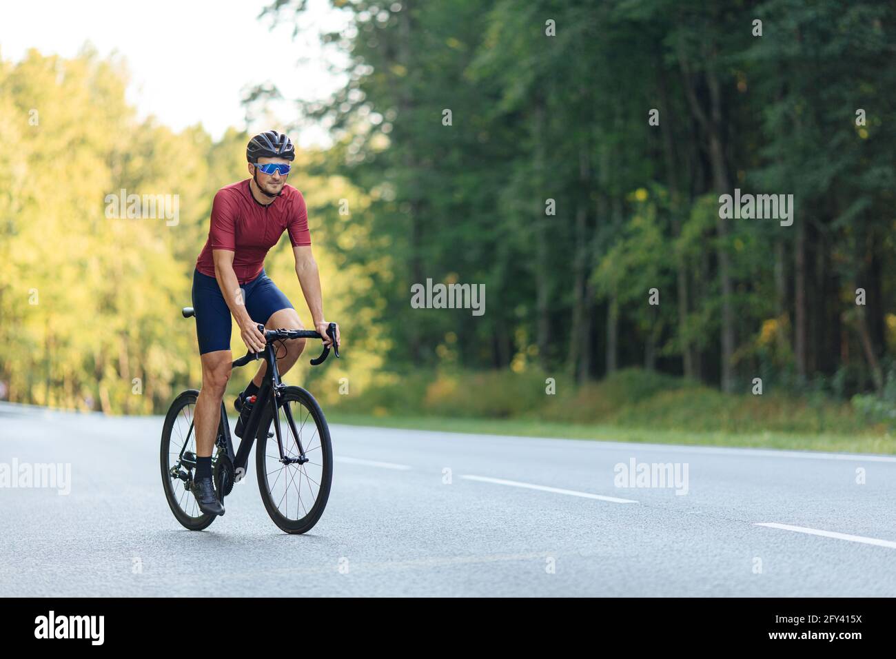 Man riding bike hi-res stock photography and images - Alamy