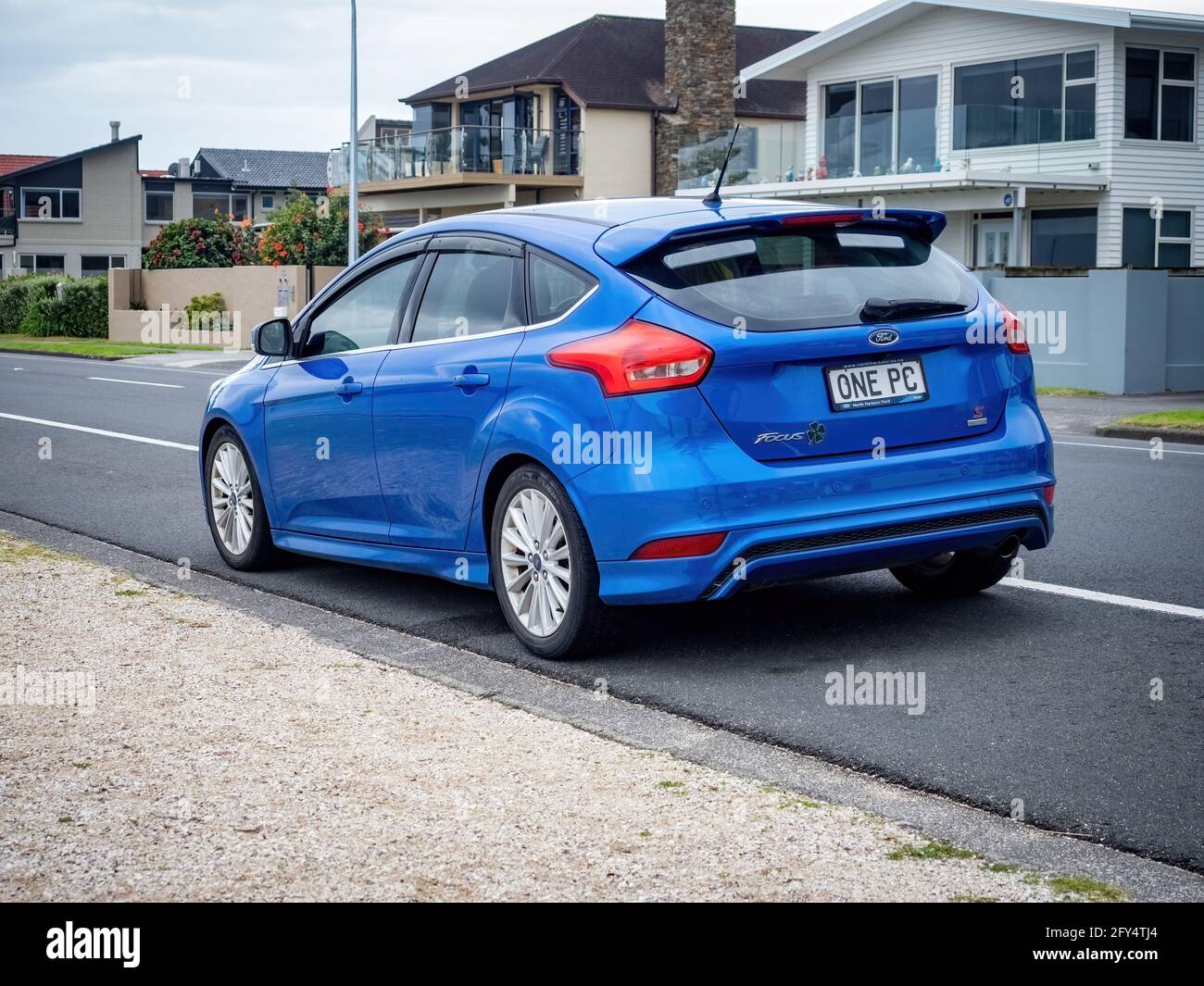 AUCKLAND, NEW ZEALAND - May 18, 2021: View of blue Ford Focus on road ...