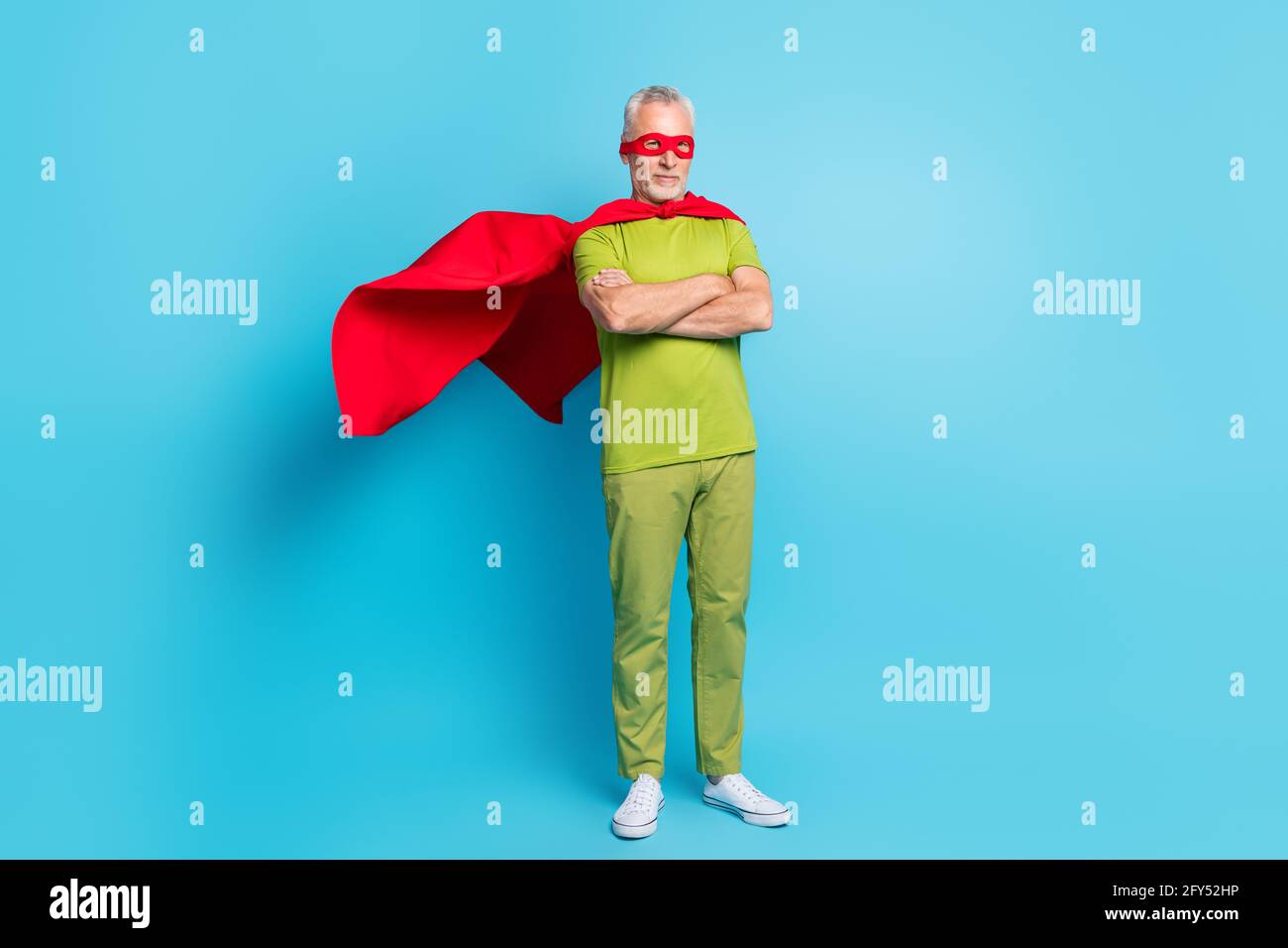 Full length body size view of attractive grey-haired superman folded ...