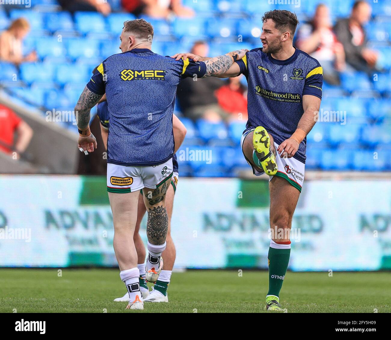 Toby King (4) and Josh Charnley (5) of Warrington Wolves during pre ...