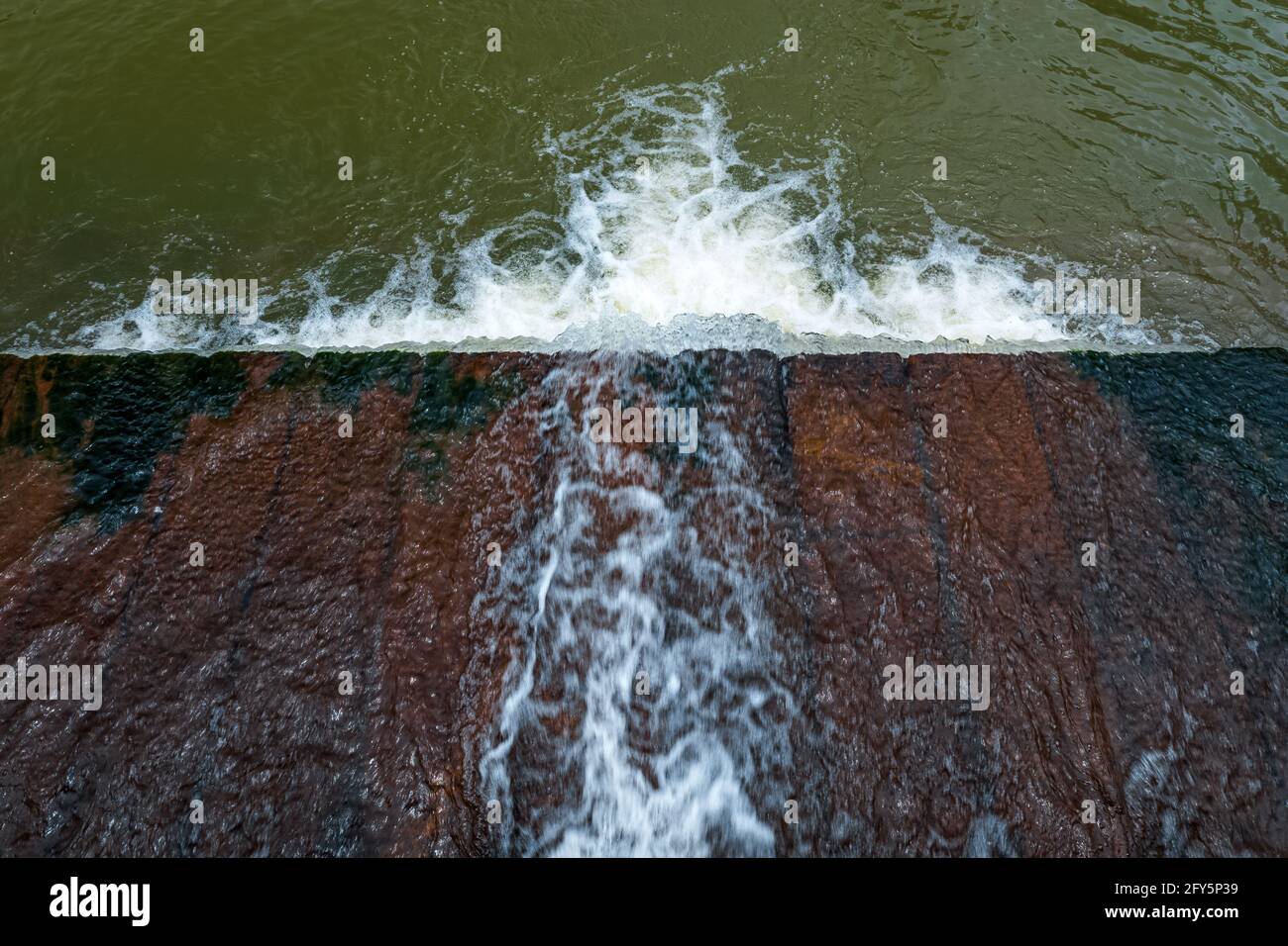 River water flowing from dam in rainy season Stock Photo - Alamy