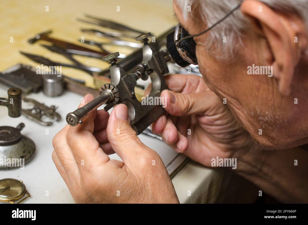 old watchmaker at work Stock Photo - Alamy
