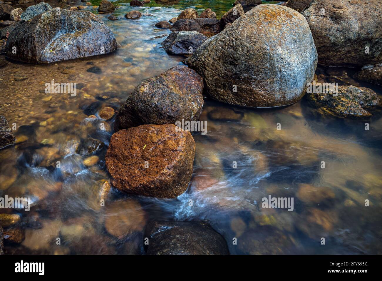 Water flowing through natural rock hi-res stock photography and images ...