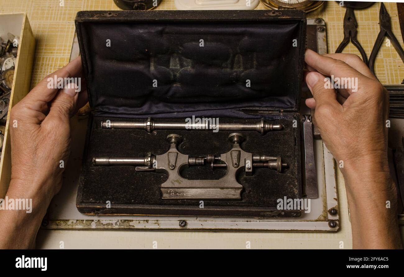 old watchmaker's tool: clock lathe in the box Stock Photo - Alamy
