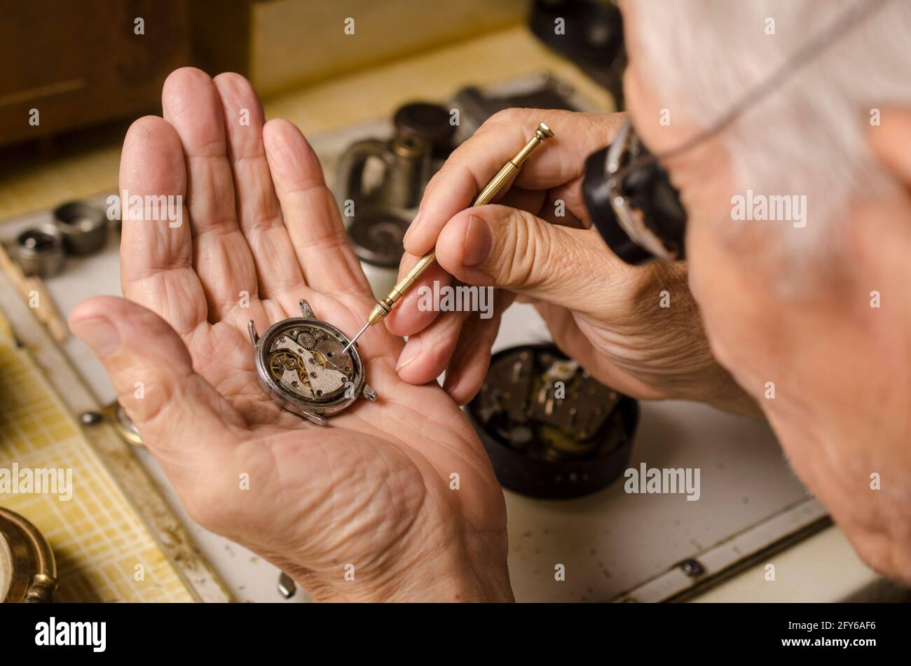 old watchmaker at work Stock Photo - Alamy