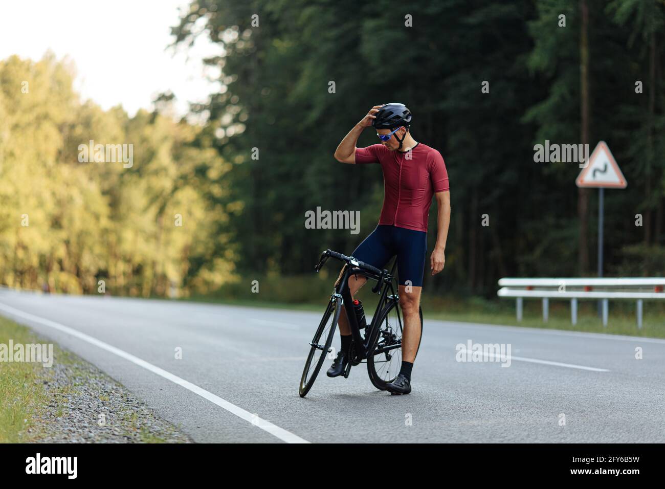 Healthy and fit cyclist resting after ride on fresh air Stock Photo - Alamy