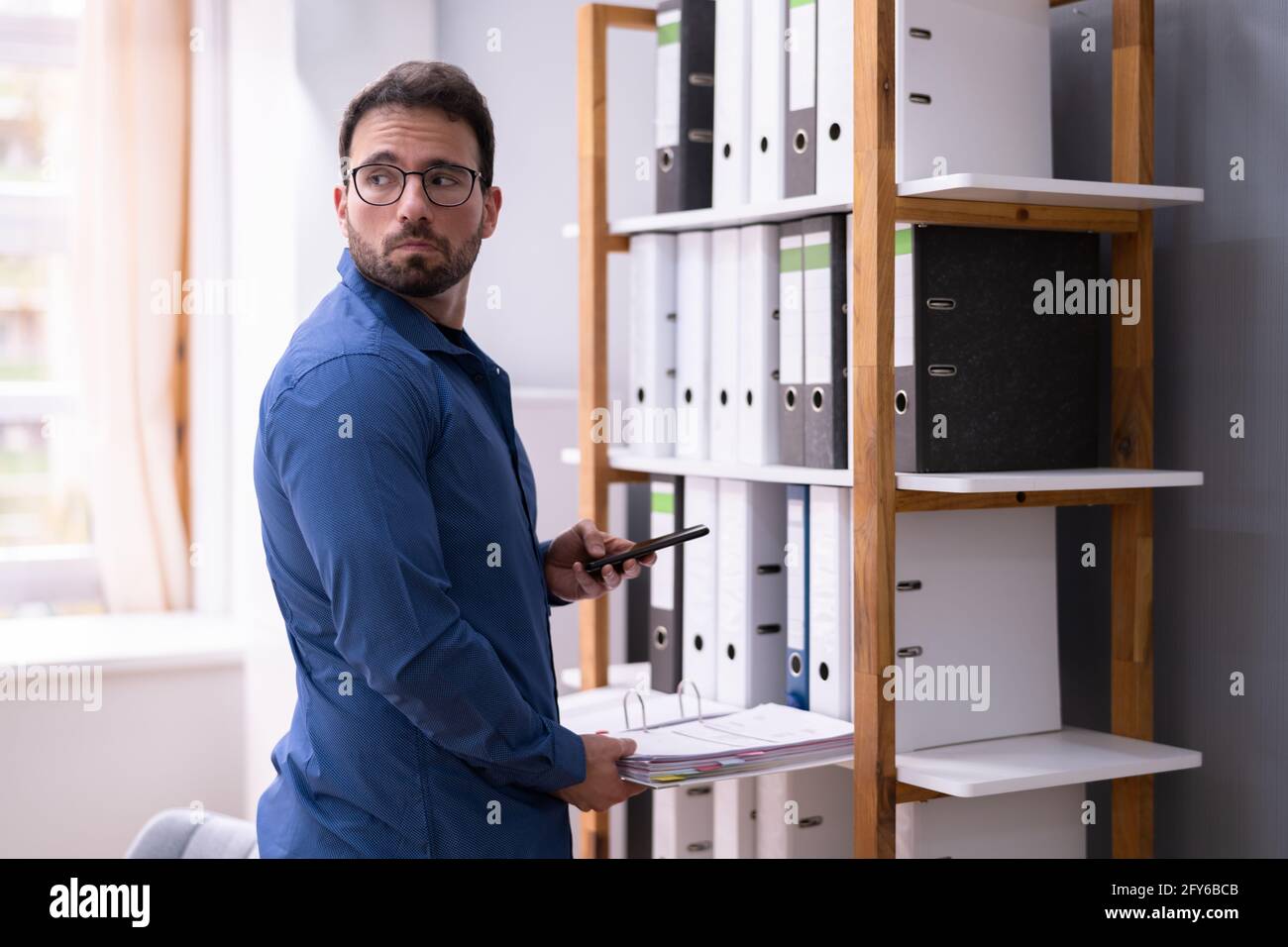 Stealing Trade Secret Document. Taking File Photo Stock Photo - Alamy