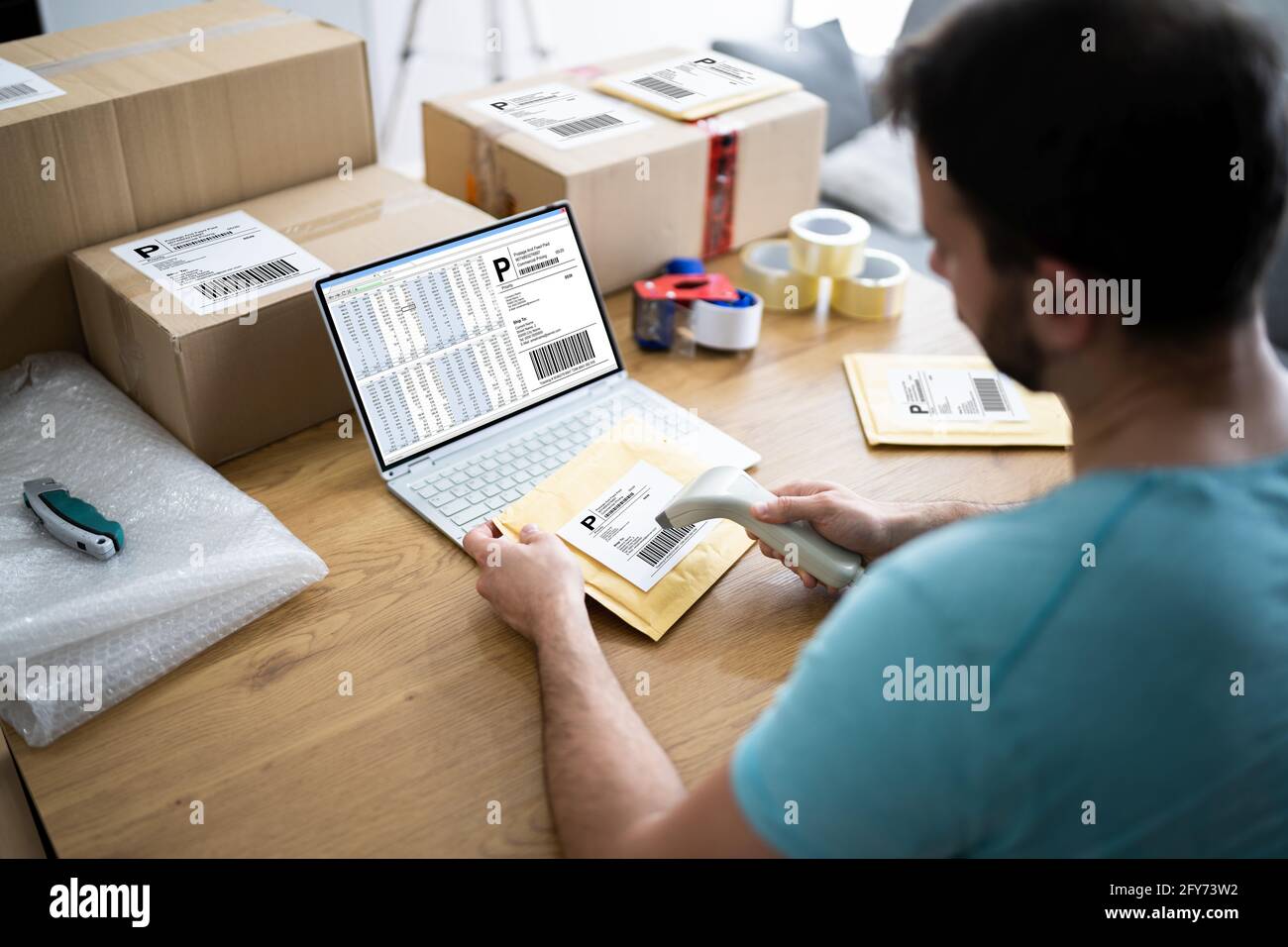 Person Packaging Orders For Online Business And Using Barcode Scanner ...