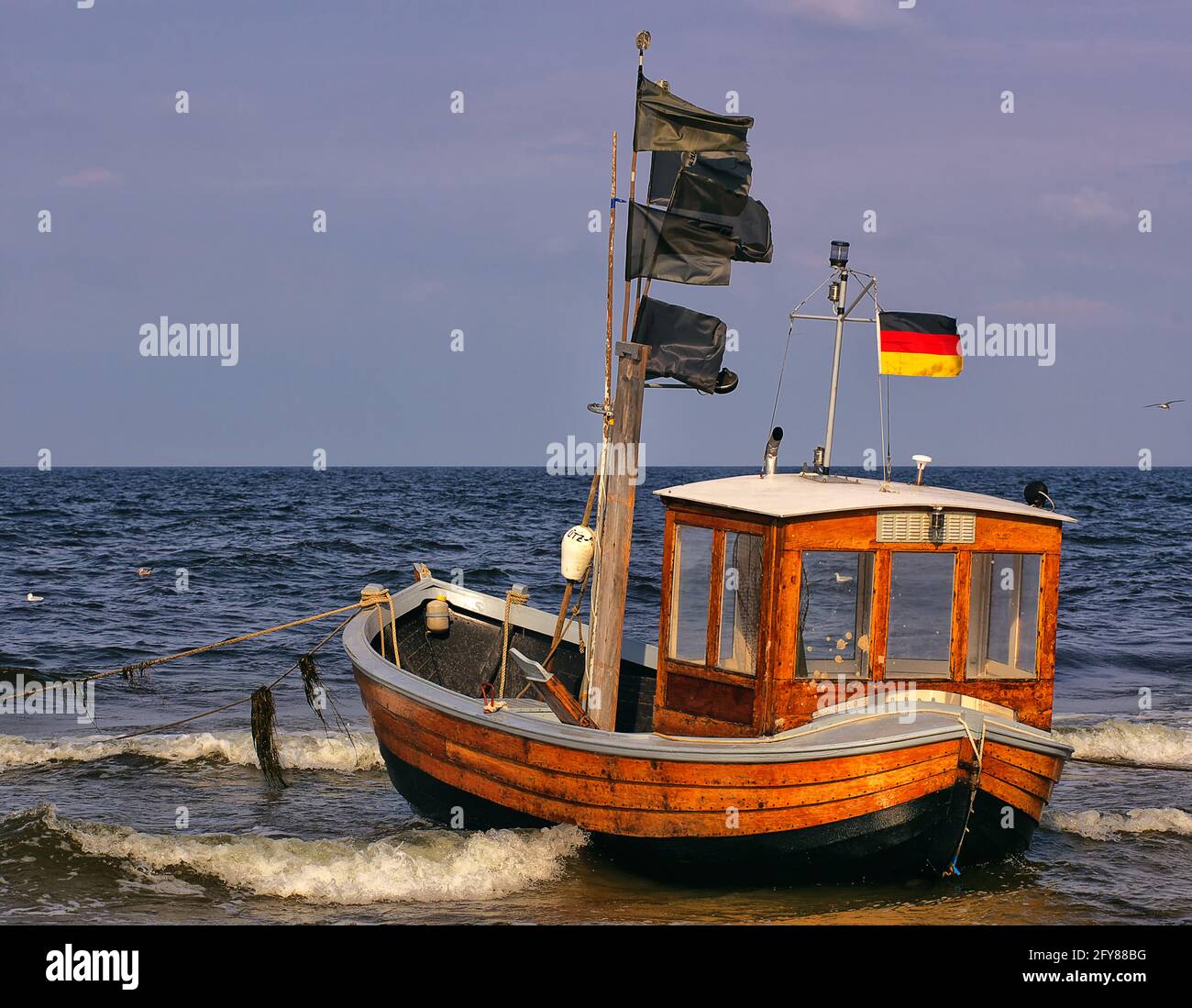 Scenic view of an old traditional boat with a German flag on the ...