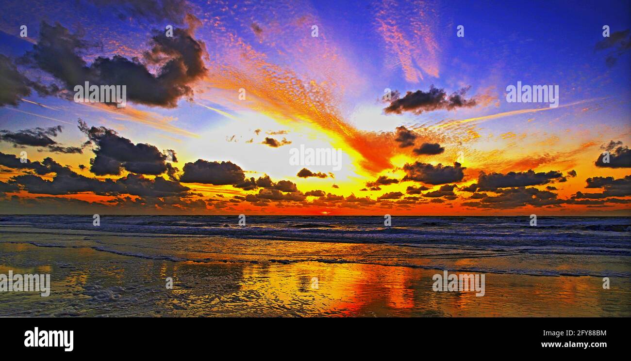 Scenic view of a wavy seashore under a beautiful sunset sky -cool for ...