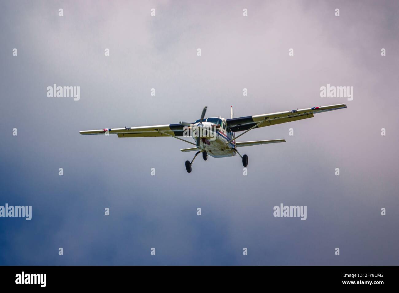 Cessna 208B Grand Caravan light aircraft returning to land after ...