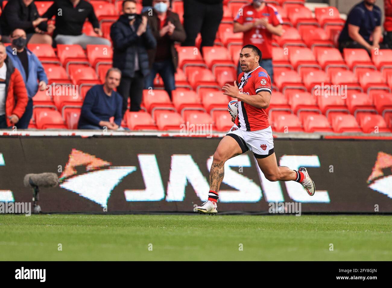 Ken Sio (2) of Salford Red Devils runs in a 70 yard solo try Stock ...