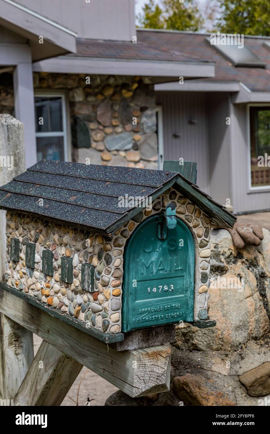 Stone mailbox among the Mushroom Houses, designed by architect Earl ...