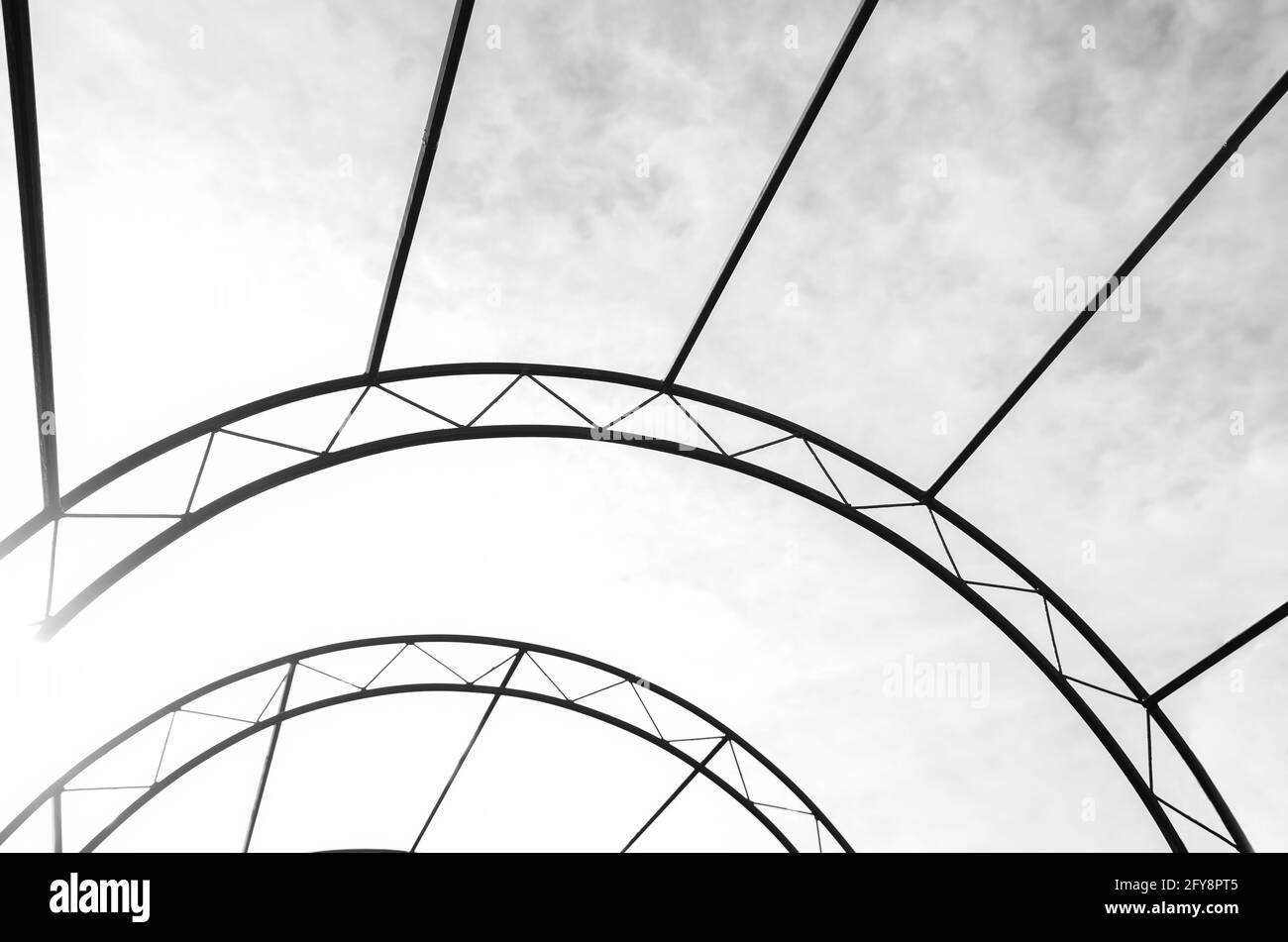 Abstraction of an of a arc metal structure on a sky background ...
