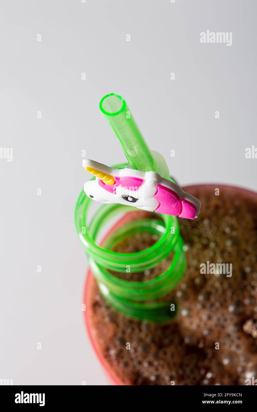 Decoration unicorn green drinking cane on a chocolate drink Stock Photo ...