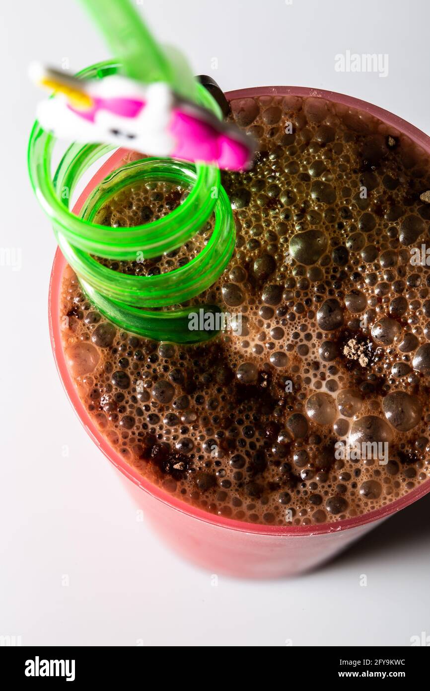 Decoration unicorn green drinking cane on a chocolate drink Stock Photo ...