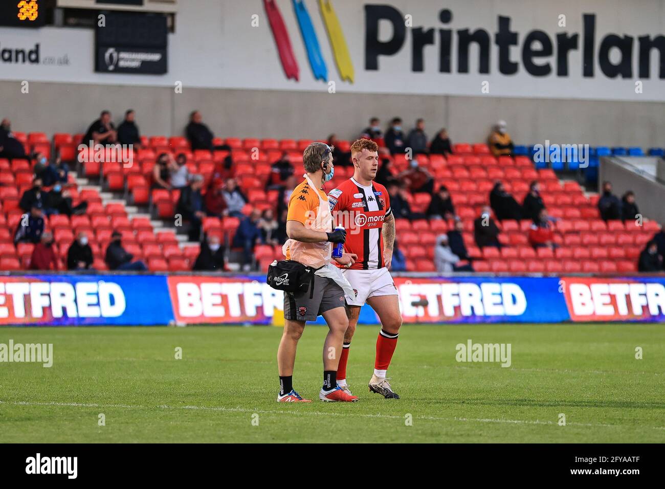 Harvey Livett (20) of Salford Red Devils leaves the pitch with an ...