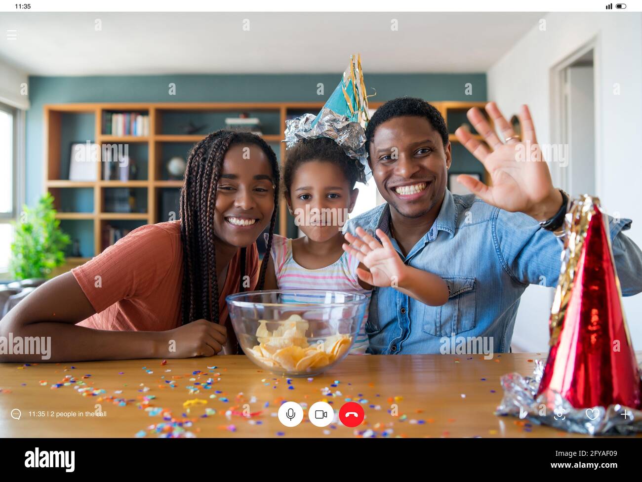 Family celebrating birthday on a video call Stock Photo - Alamy