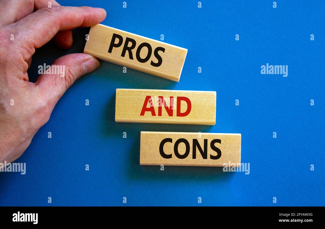 Pros and cons symbol. Wooden blocks with words 'Pros and cons ...