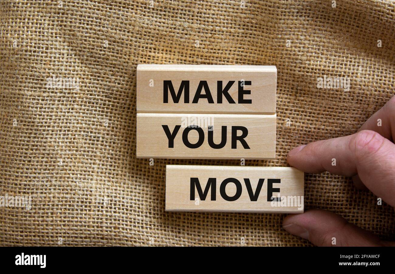 Make your move symbol. Wooden blocks with words 'Make your move ...