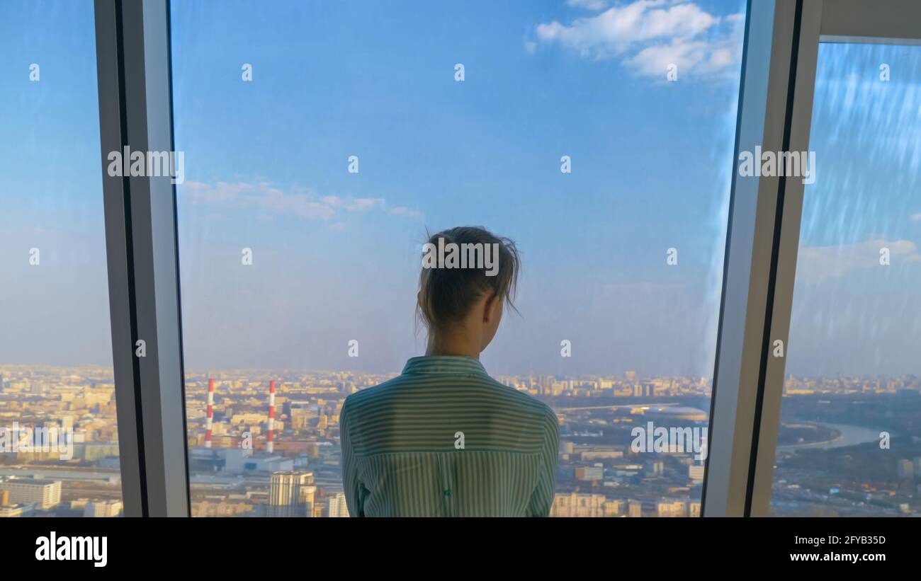 Woman back view office window pensive hi-res stock photography and ...