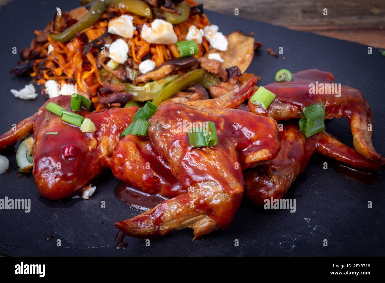 sweet and spicy hot chicken wings with sweet potato poutine in the ...