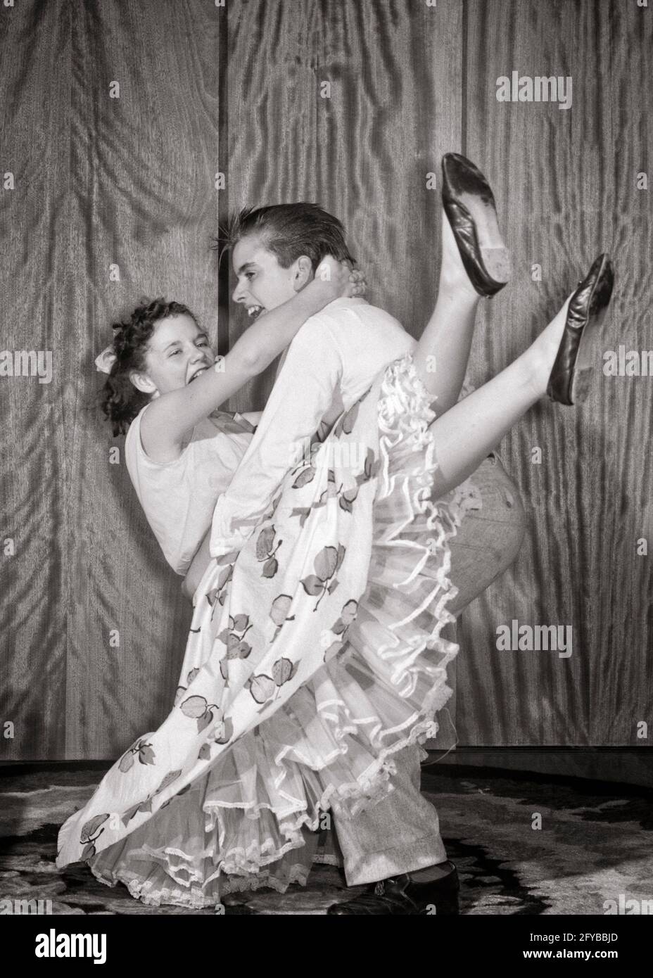 1950s LAUGHING ACTIVE TEEN COUPLE DOING JITTERBUG DANCE LIFT MOVE ...
