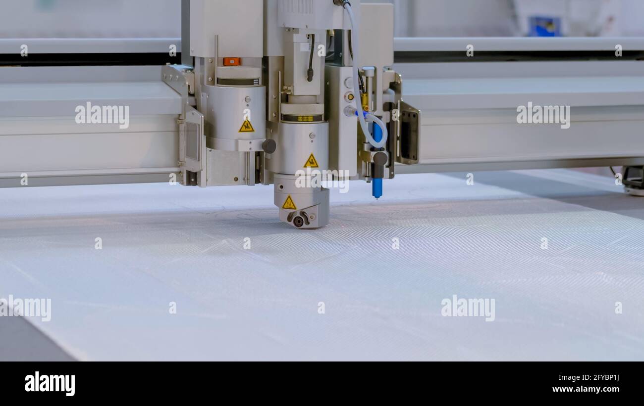 Digital cutting system - flatbed cutter, router during work at ...