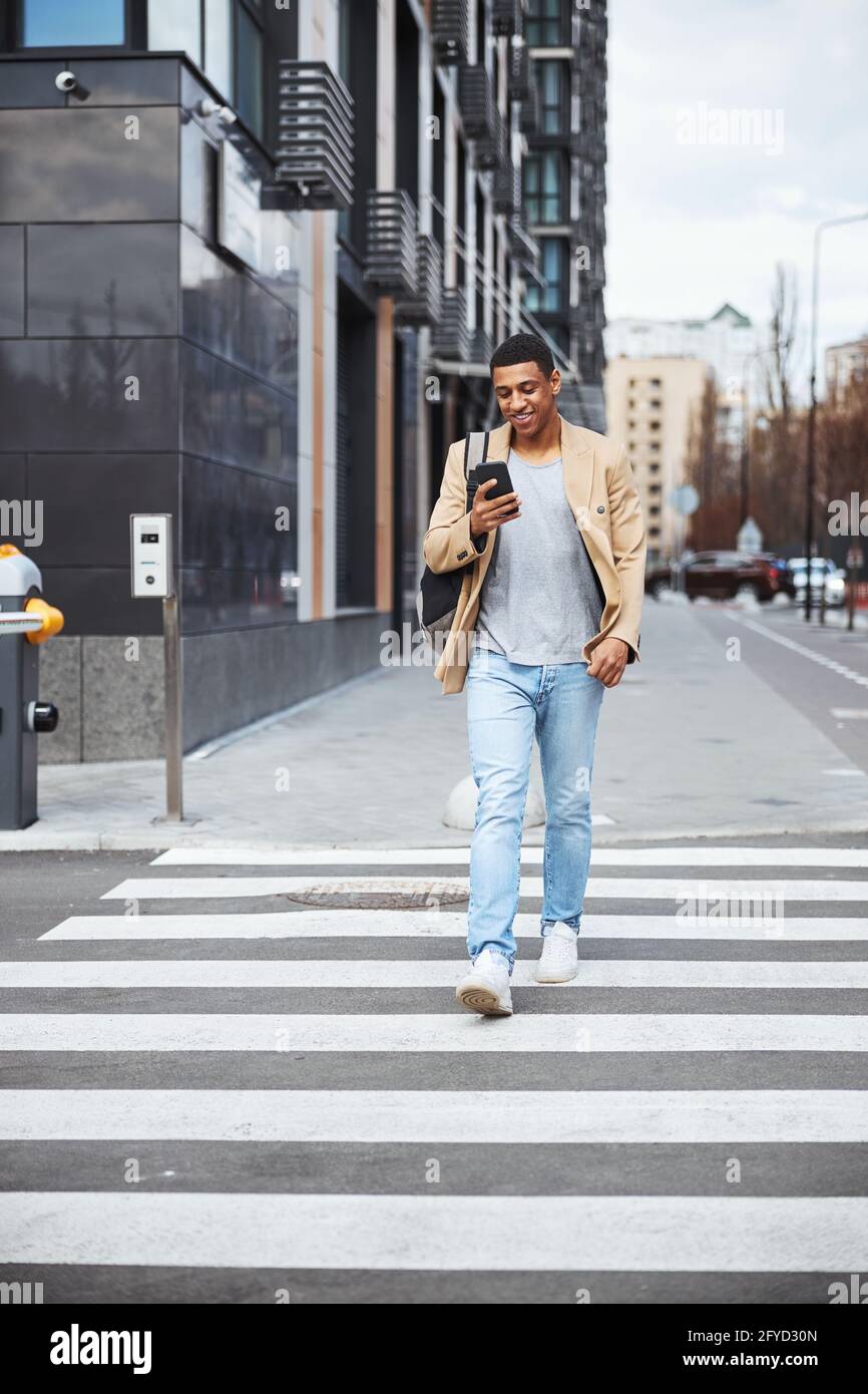 Happy male person going home after wor Stock Photo - Alamy