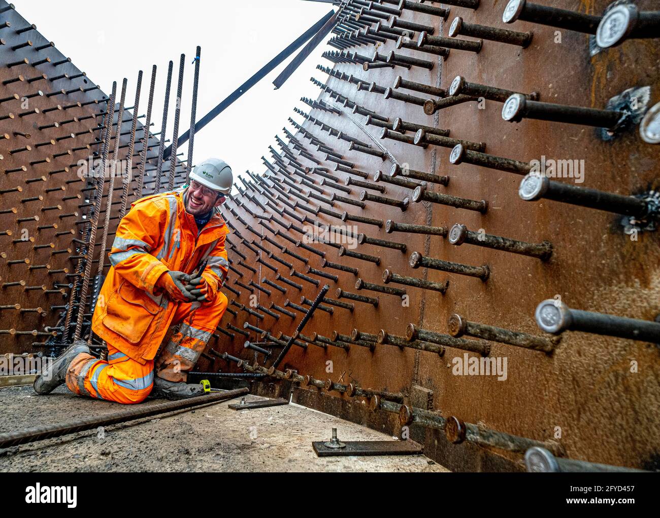 Construction workers in action on construction site Stock Photo - Alamy